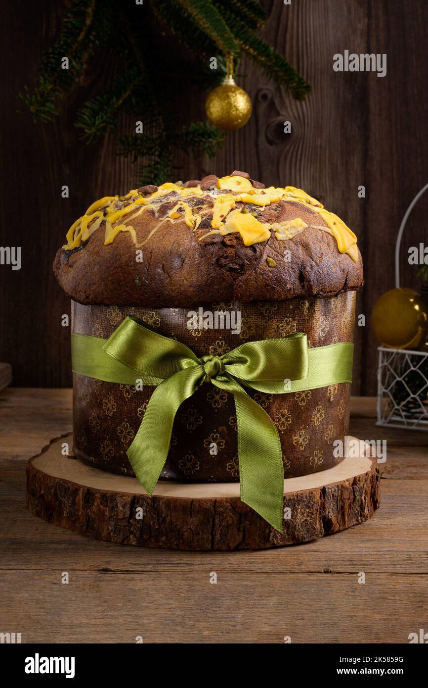 Traditional Italian Christmas Cake Panettone with green bow and festive ...