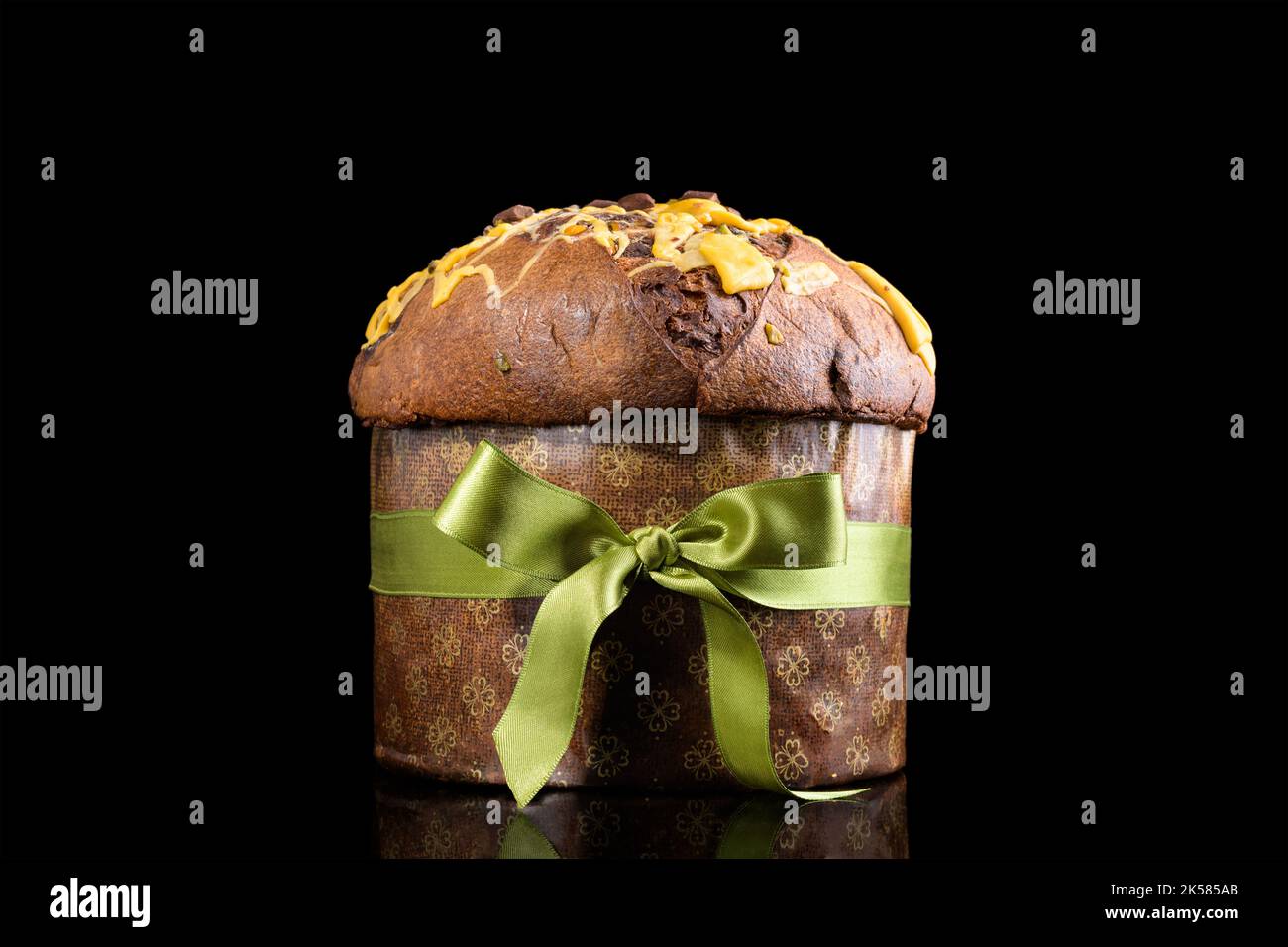 Traditional Italian Christmas Cake Panettone with green bow isolated on ...
