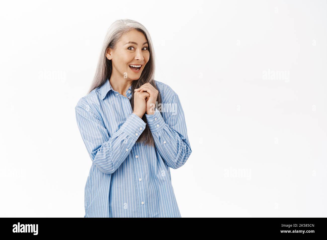 Smiling happy old lady, japanese middle aged woman looking excited at ...