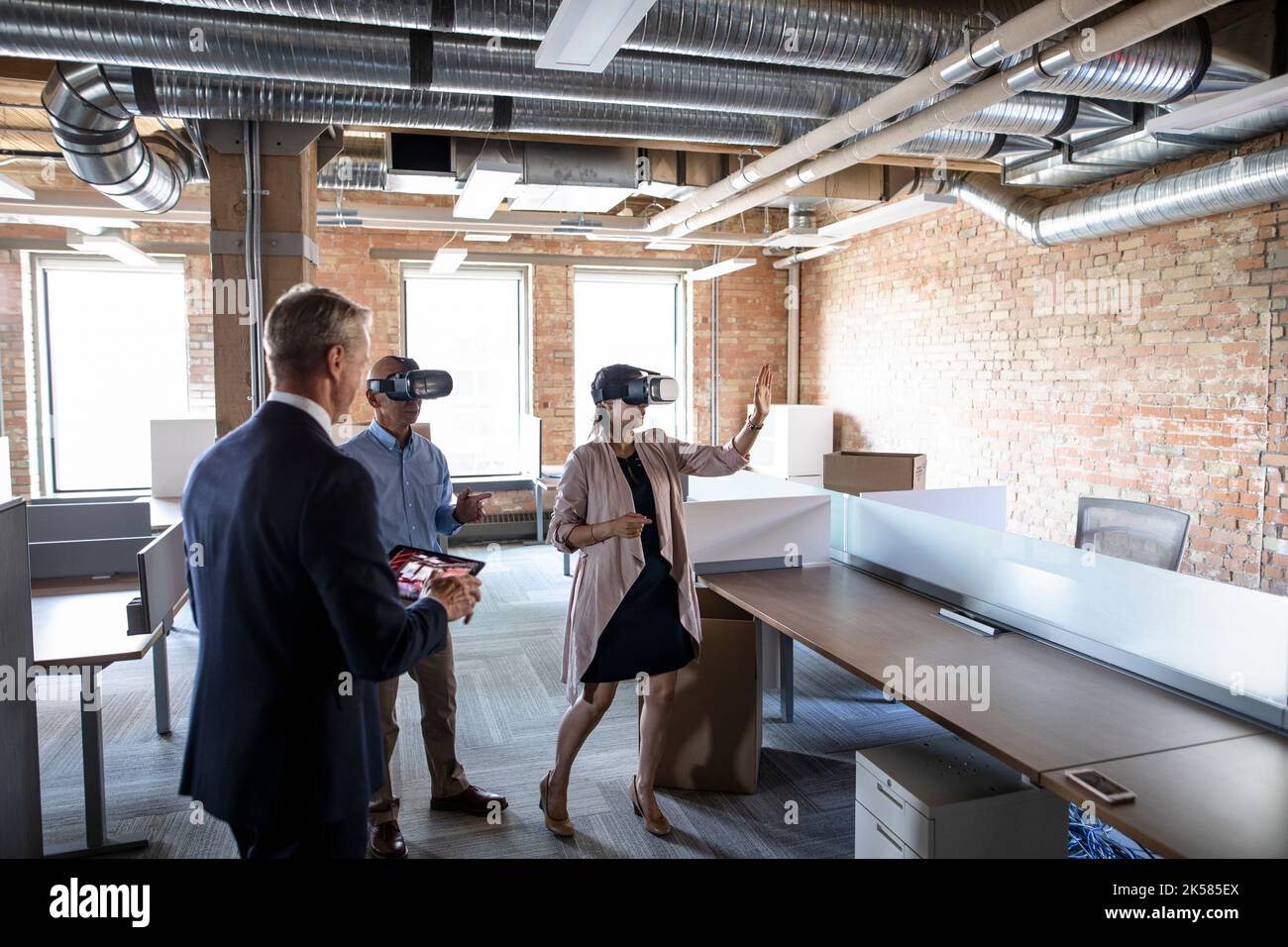 business people using VR simulators to visualize new office Stock Photo ...