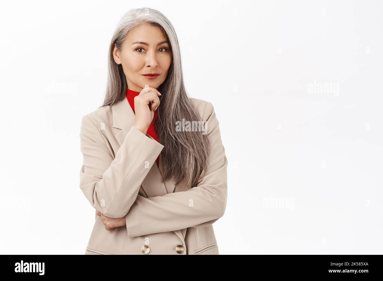 Image of stylish senior asian woman in suit, smiling and looking ...