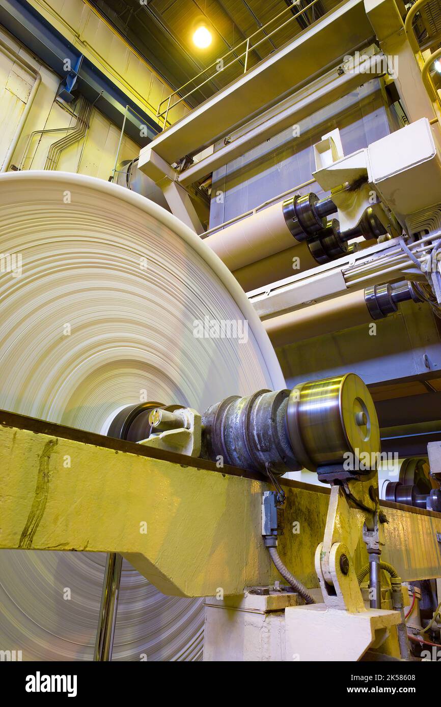 Big Rolls Of Paper Coming Out Of The Machinery In A Paper Mill Plant big-rolls-of-paper-coming-out-of-the-machinery-in-a-paper-mill-plant