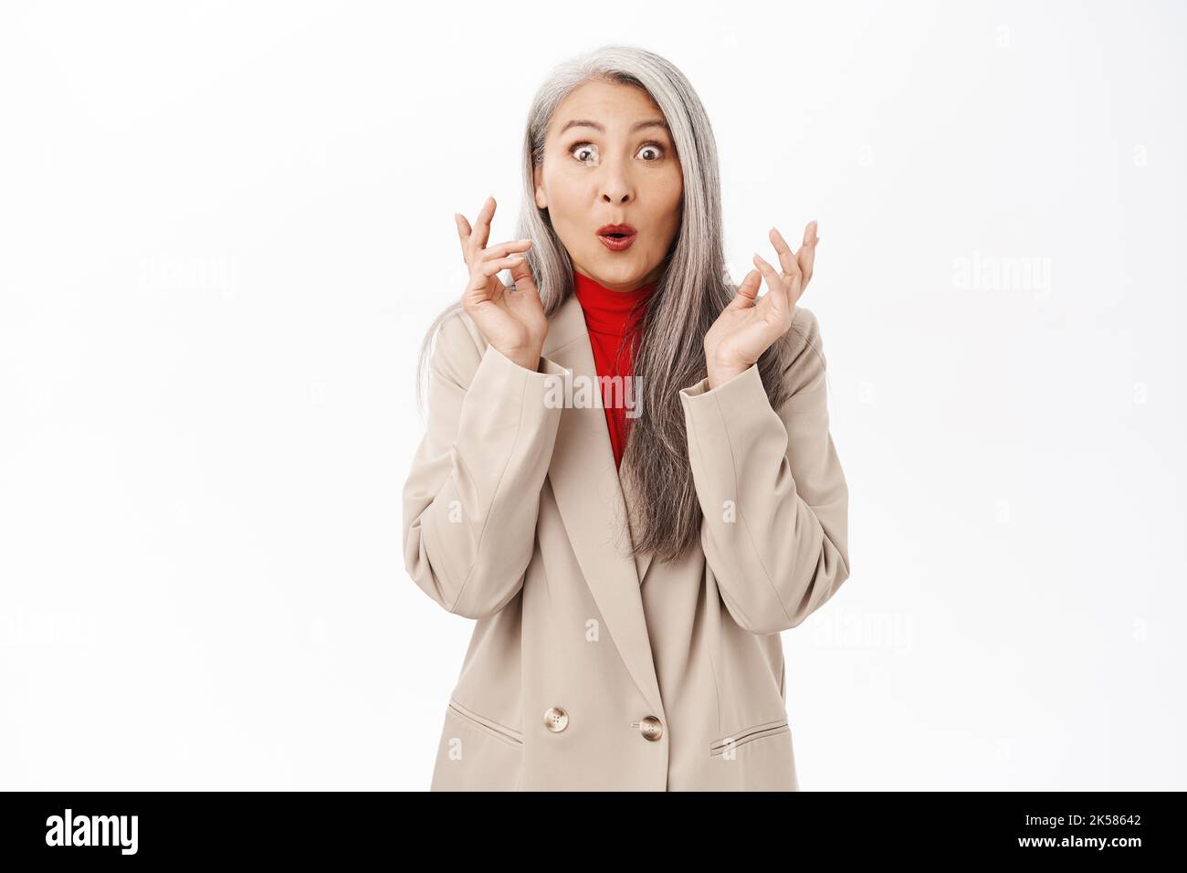 Portrait of asian businesswoman, senior lady looking amazed, surprised ...