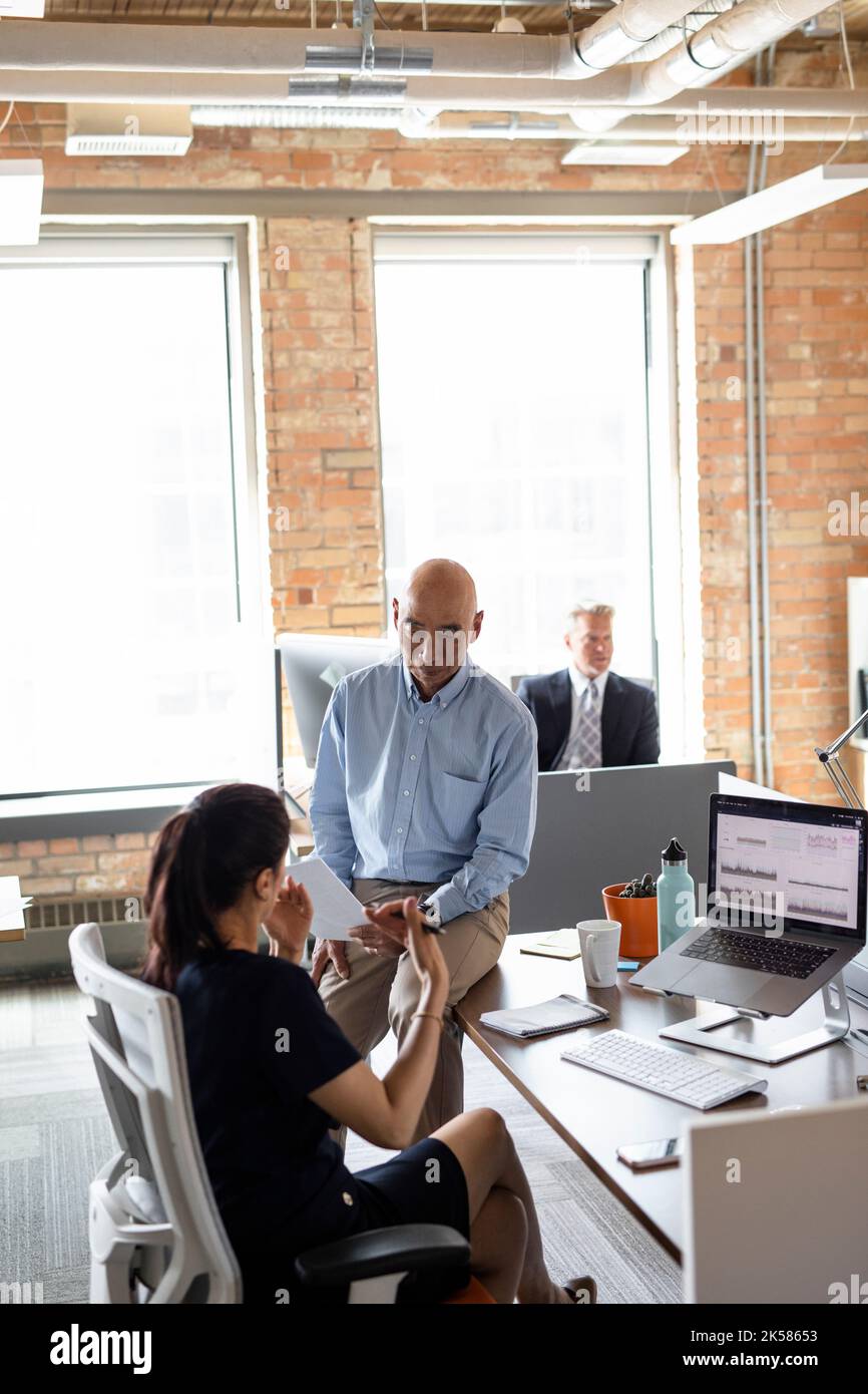 Business man woman talking desk hi-res stock photography and images - Alamy