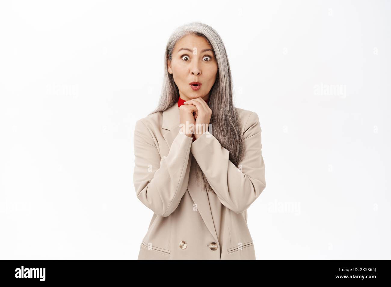 Portrait of beautiful asian senior lady, businesswoman in suit looking ...