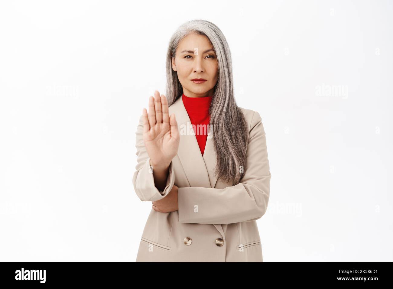Image of serious-looking corporate woman in business, showing stop ...