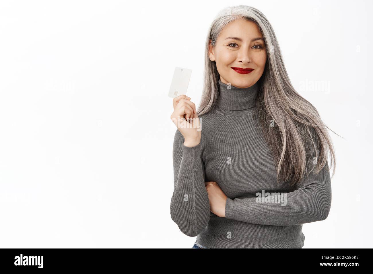 Confident smiling asian senior woman, beautiful korean female model ...