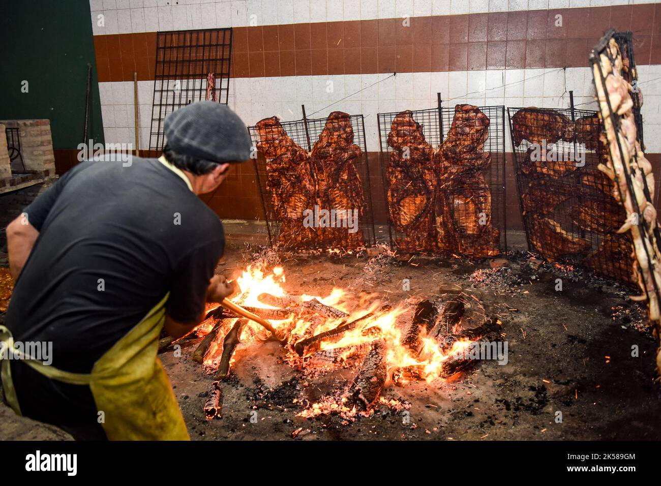 Gaucho grilling , barbecue, sausage and cow ribs, traditional argentine ...