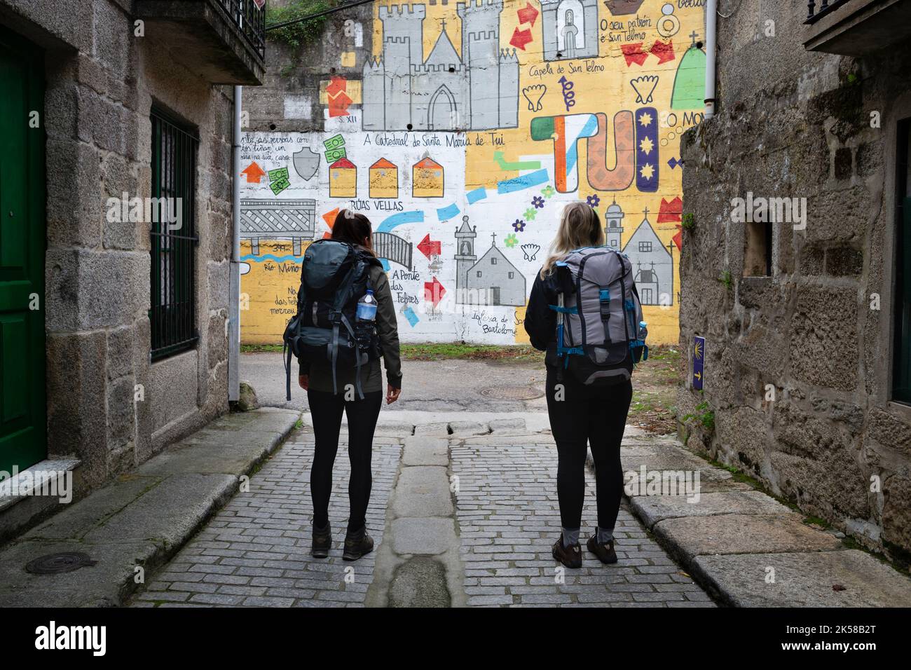 Two pilgrims on Obispo Maceiras street in Tui. Camino de Santiago ...