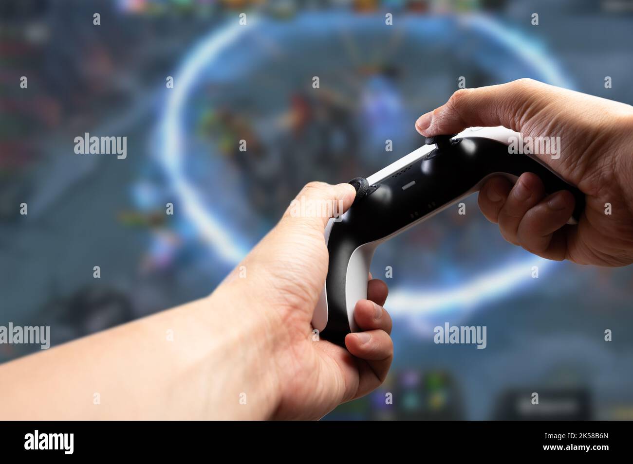 Modern gamepad, GAM22ICB in the hands of a gamer on a technological ...