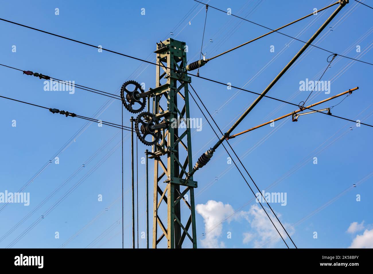 Cables, brackets and gears on a metal pole for overhead lines for ...