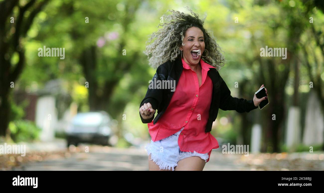 Happy woman dancing with joy and freedom, carefree extroverted person ...