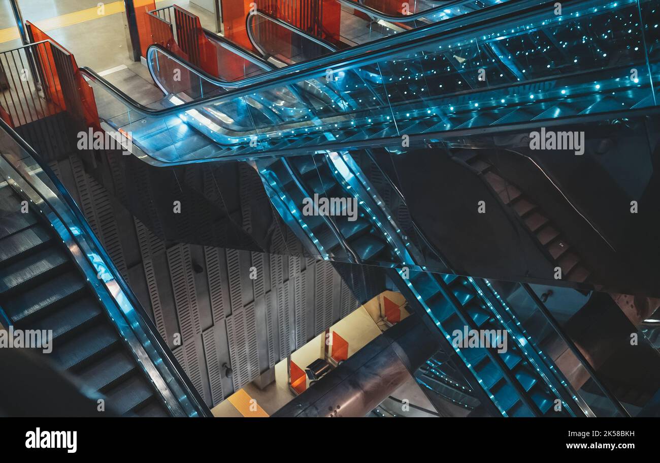 Electric escalators in metro. Moving staircases Stock Photo - Alamy