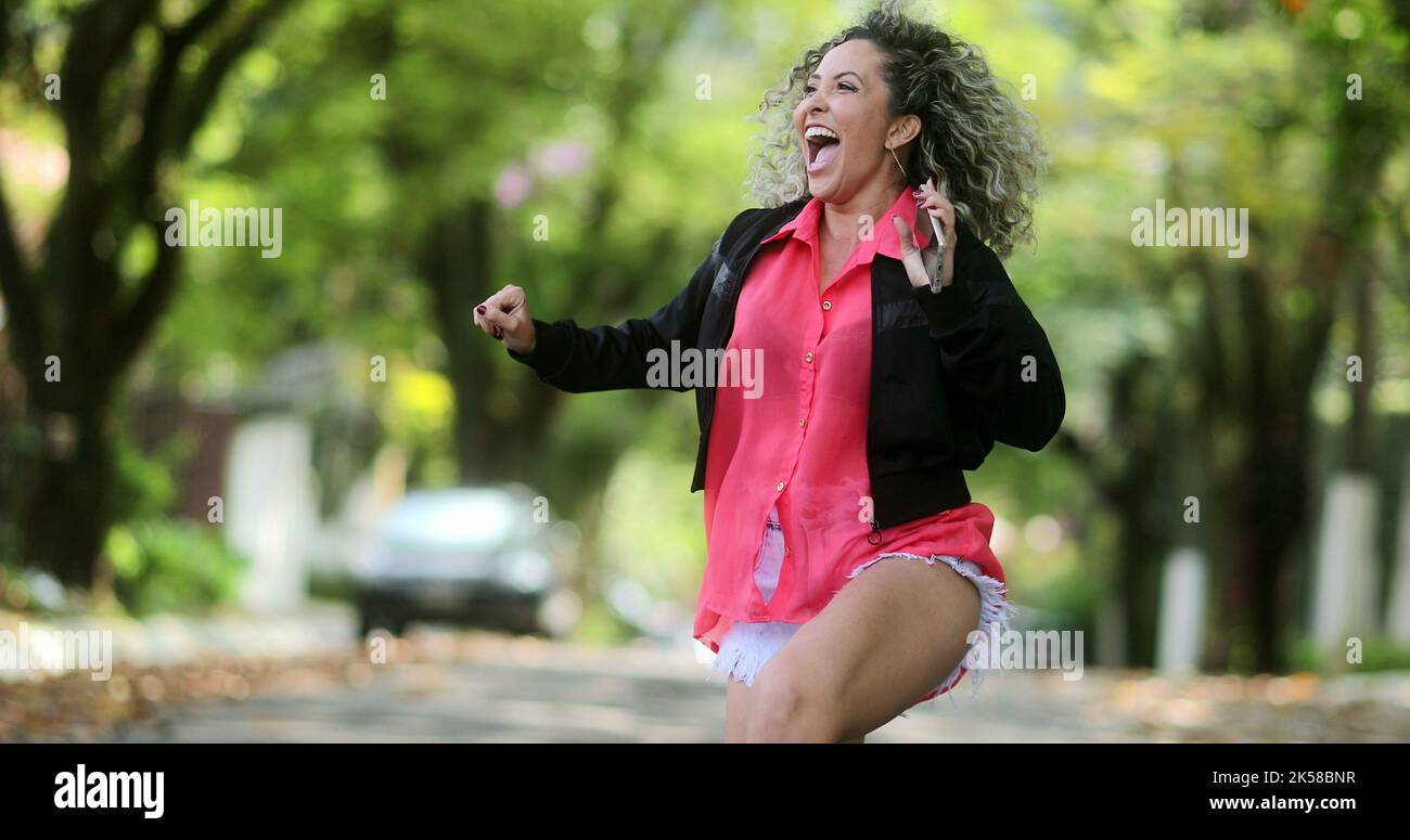 Happy woman dancing with joy and freedom, carefree extroverted person ...