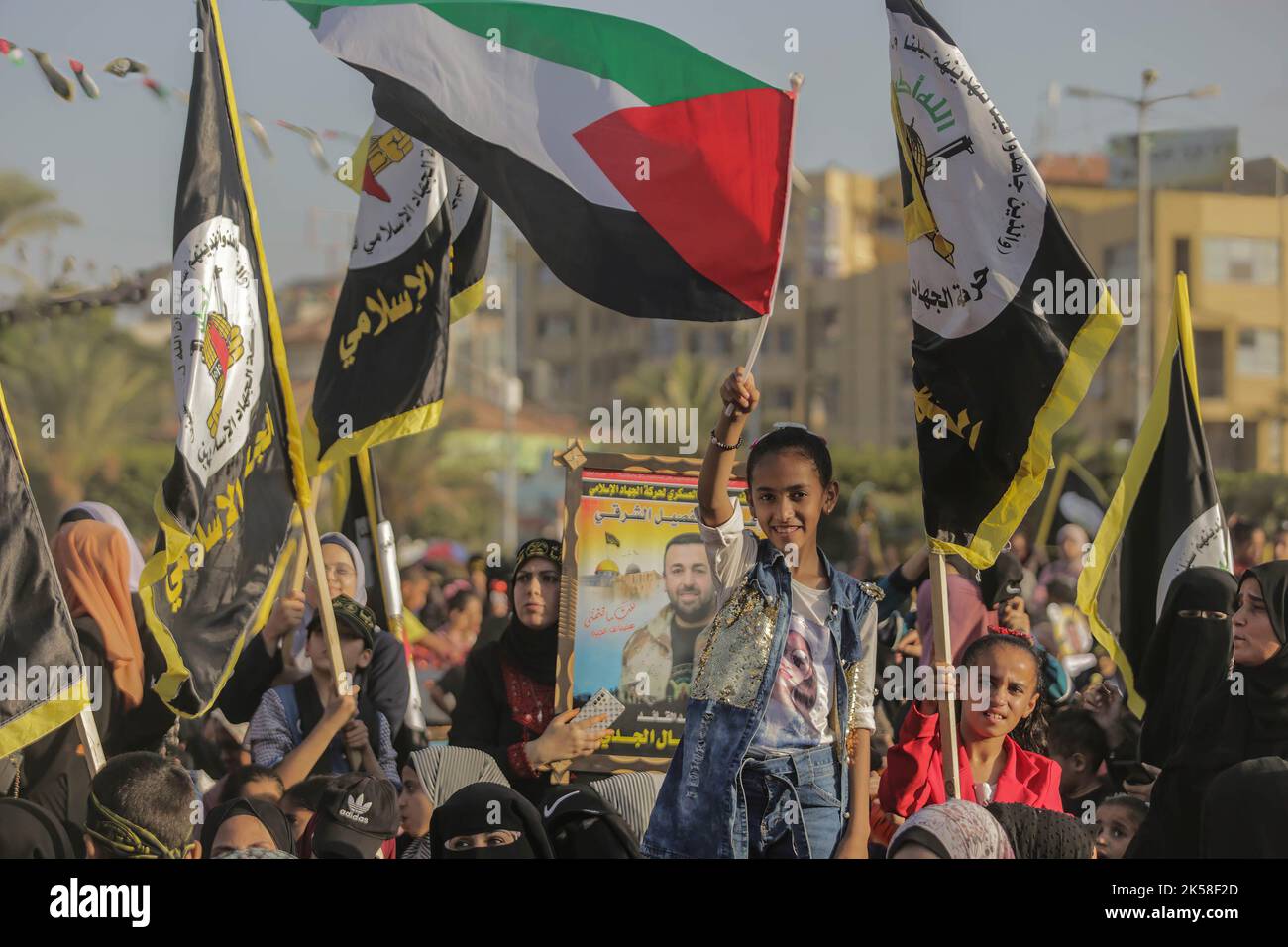 Palestinian Islamic Jihad kid supporter waves a flag as they attend the ...