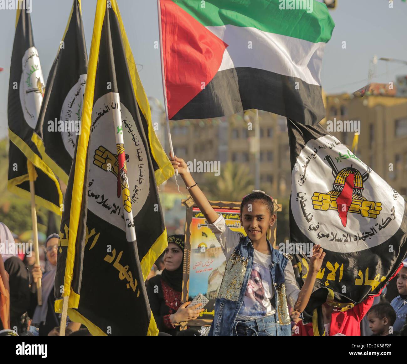 Palestinian Islamic Jihad kid supporter waves a flag as they attend the ...