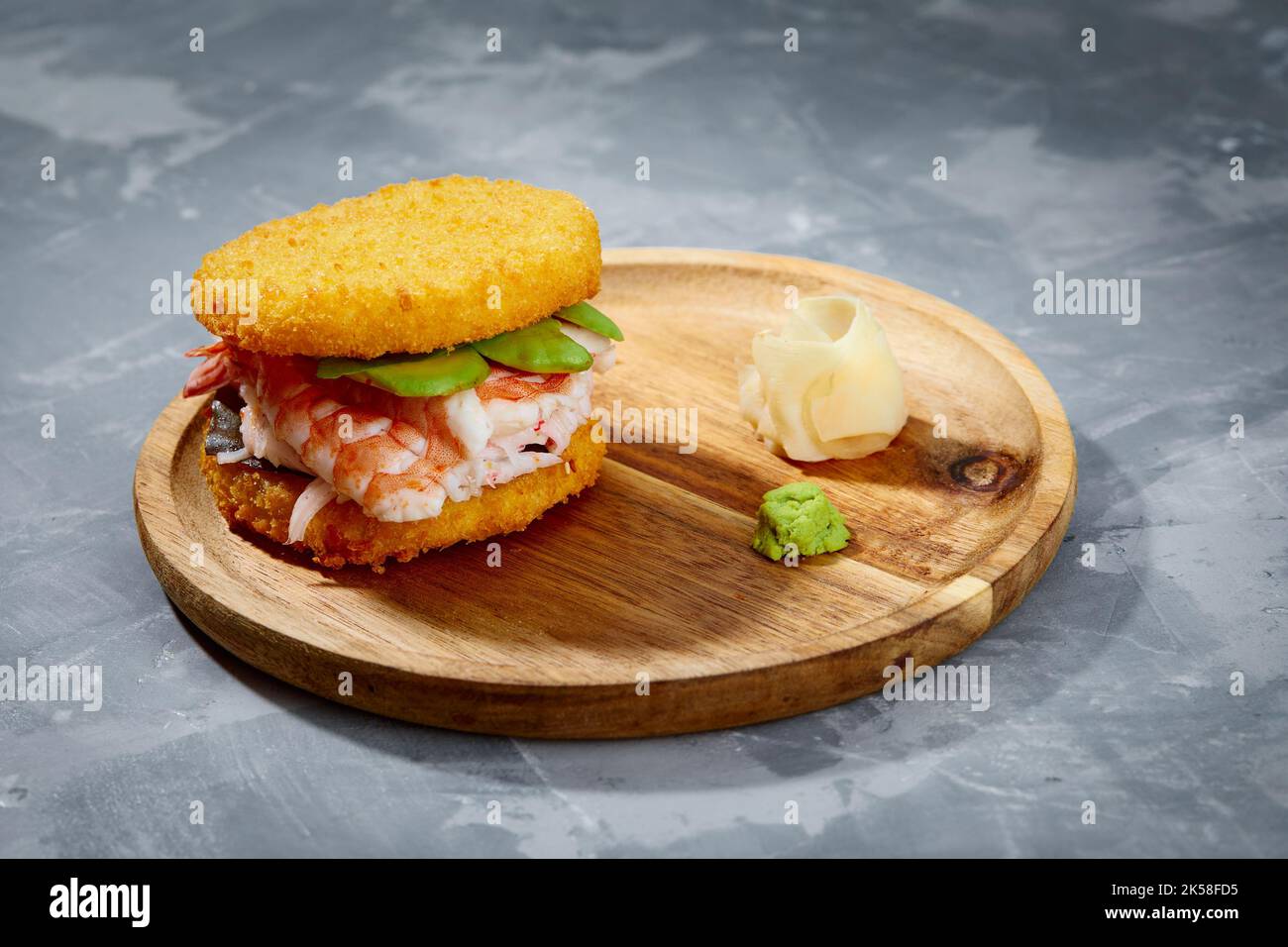 Pan-Asian cuisine concept. Japanese sushi burger made from rice bread ...