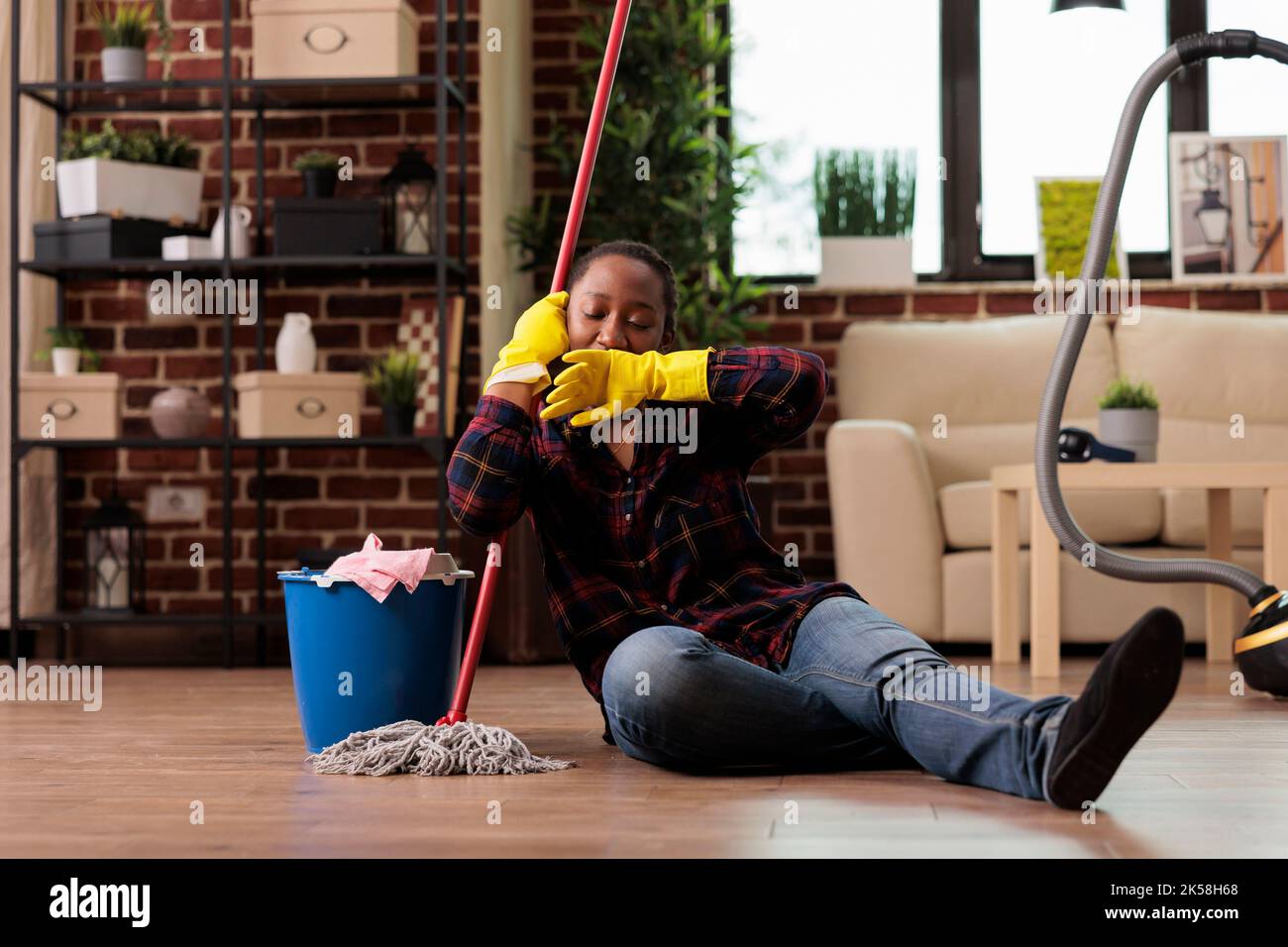 Stressed woman from daily work sitting on the floor with no strength to ...