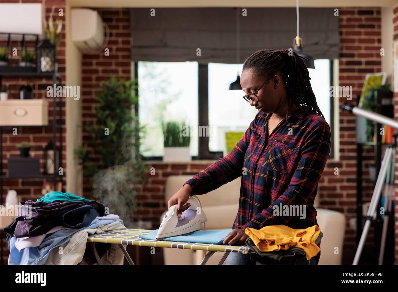 African woman doing laundry hi-res stock photography and images - Alamy