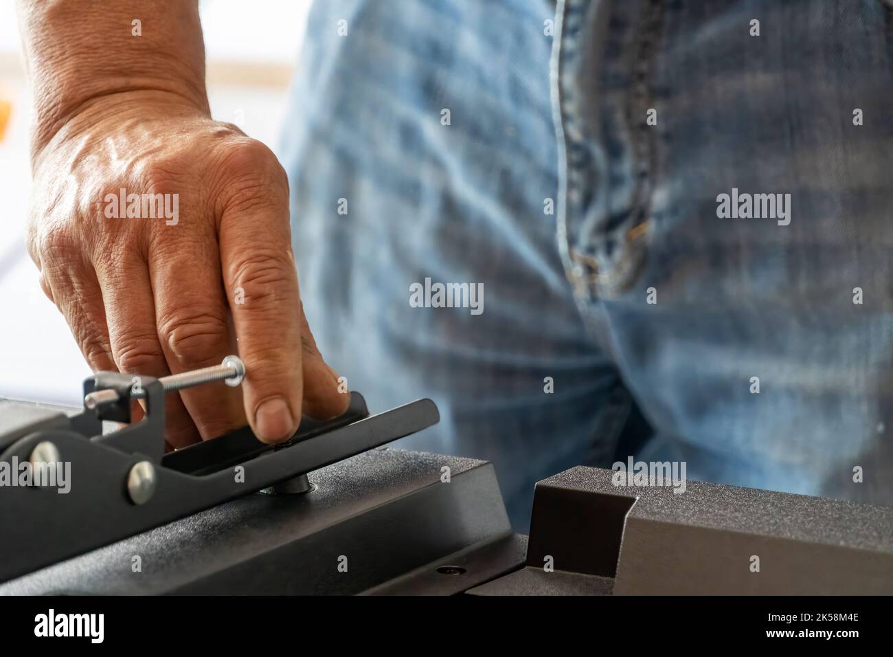 man installing the wall base for the television, it is a smart tv ...