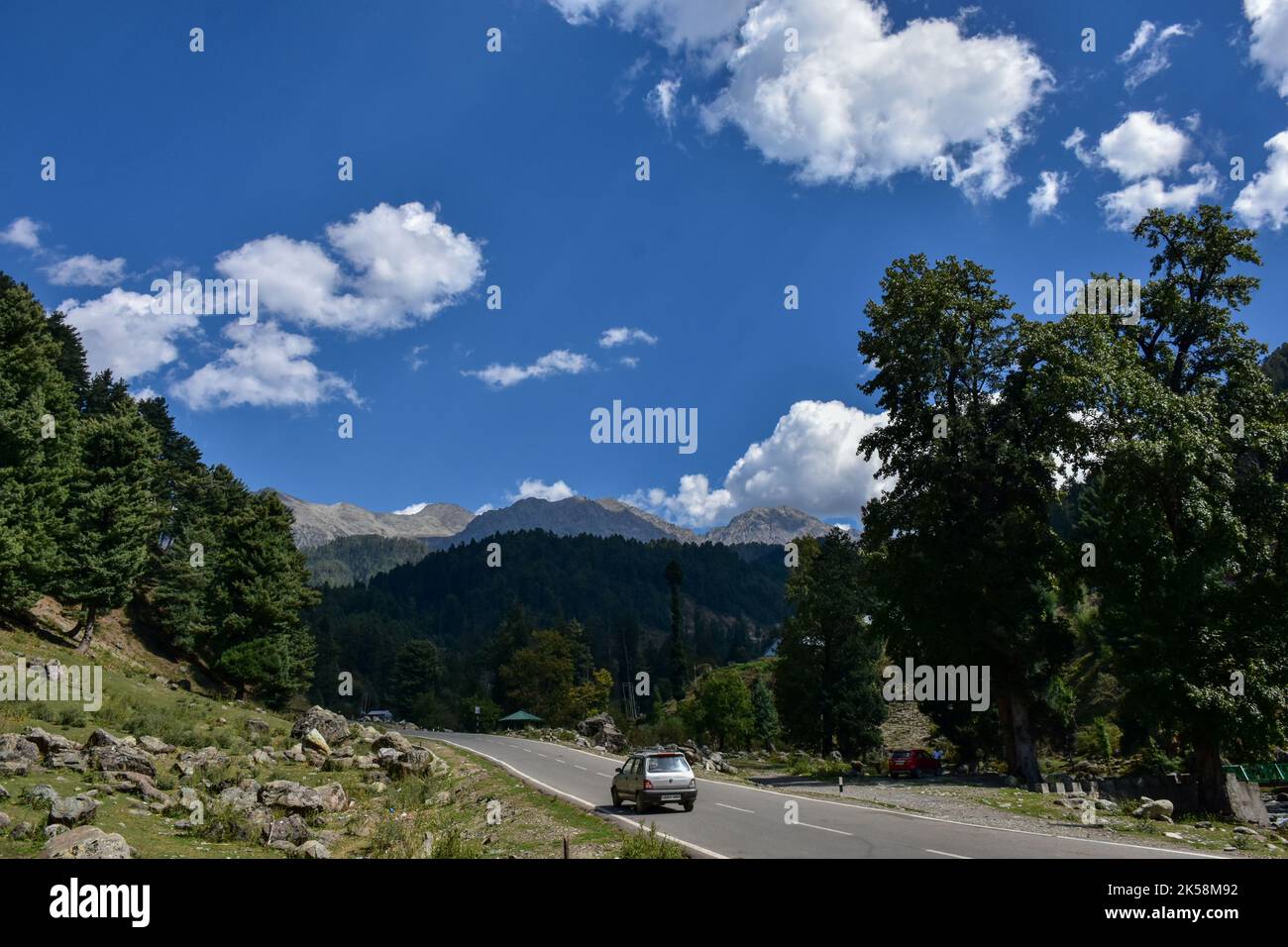 A vehicle moves on the road in Daksum, about 100kms, south of Srinagar ...