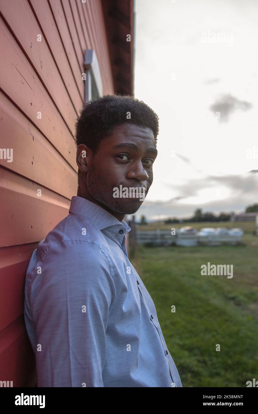 Handsome young man outside barn hi-res stock photography and images - Alamy