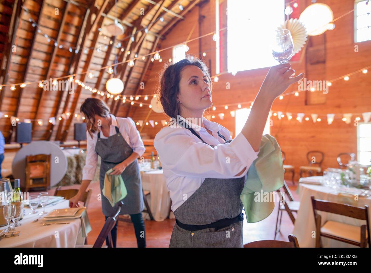 Preparing for wedding reception in barn hi-res stock photography and ...