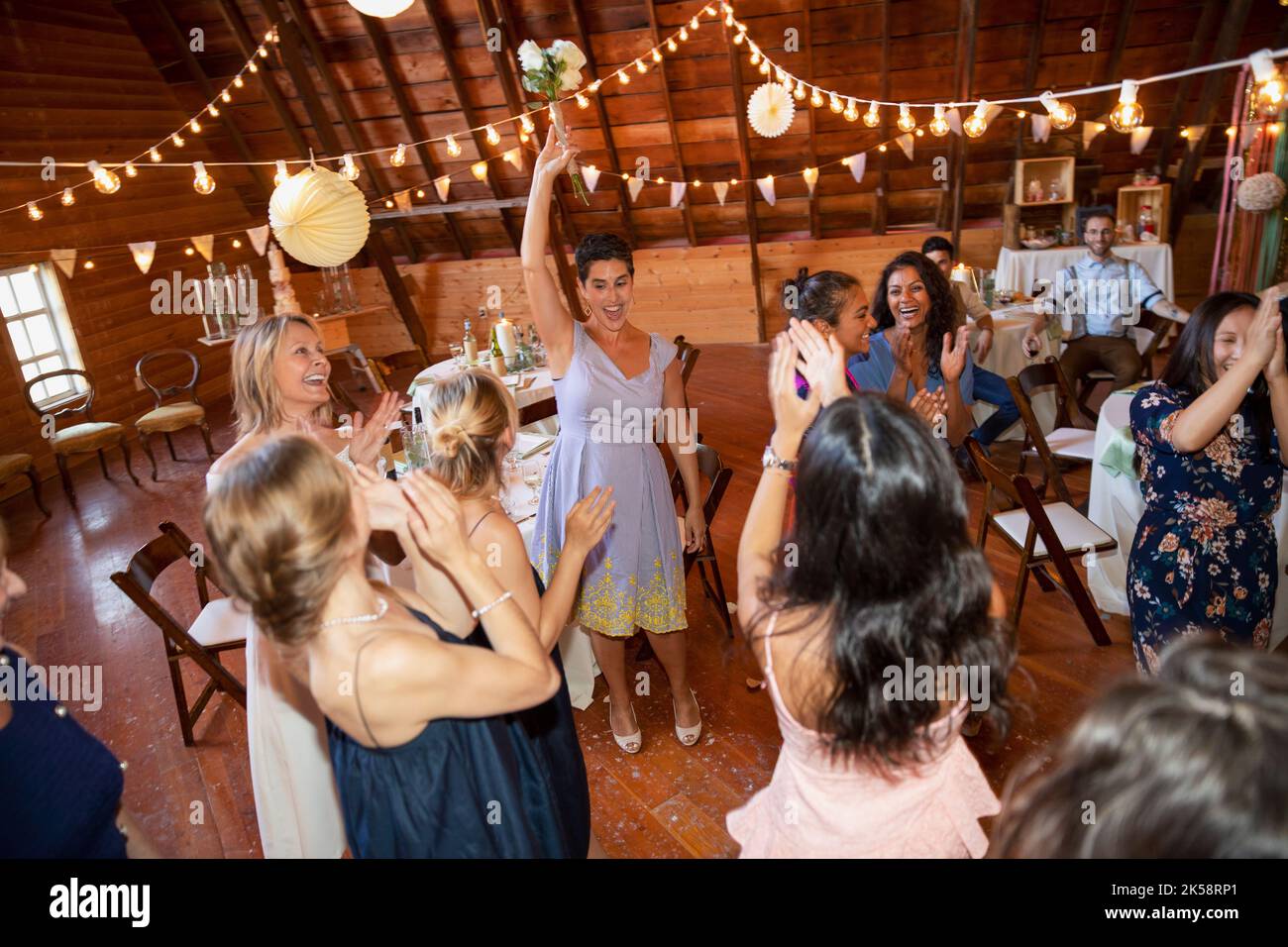 Woman catching wedding bouquet hi-res stock photography and images - Alamy