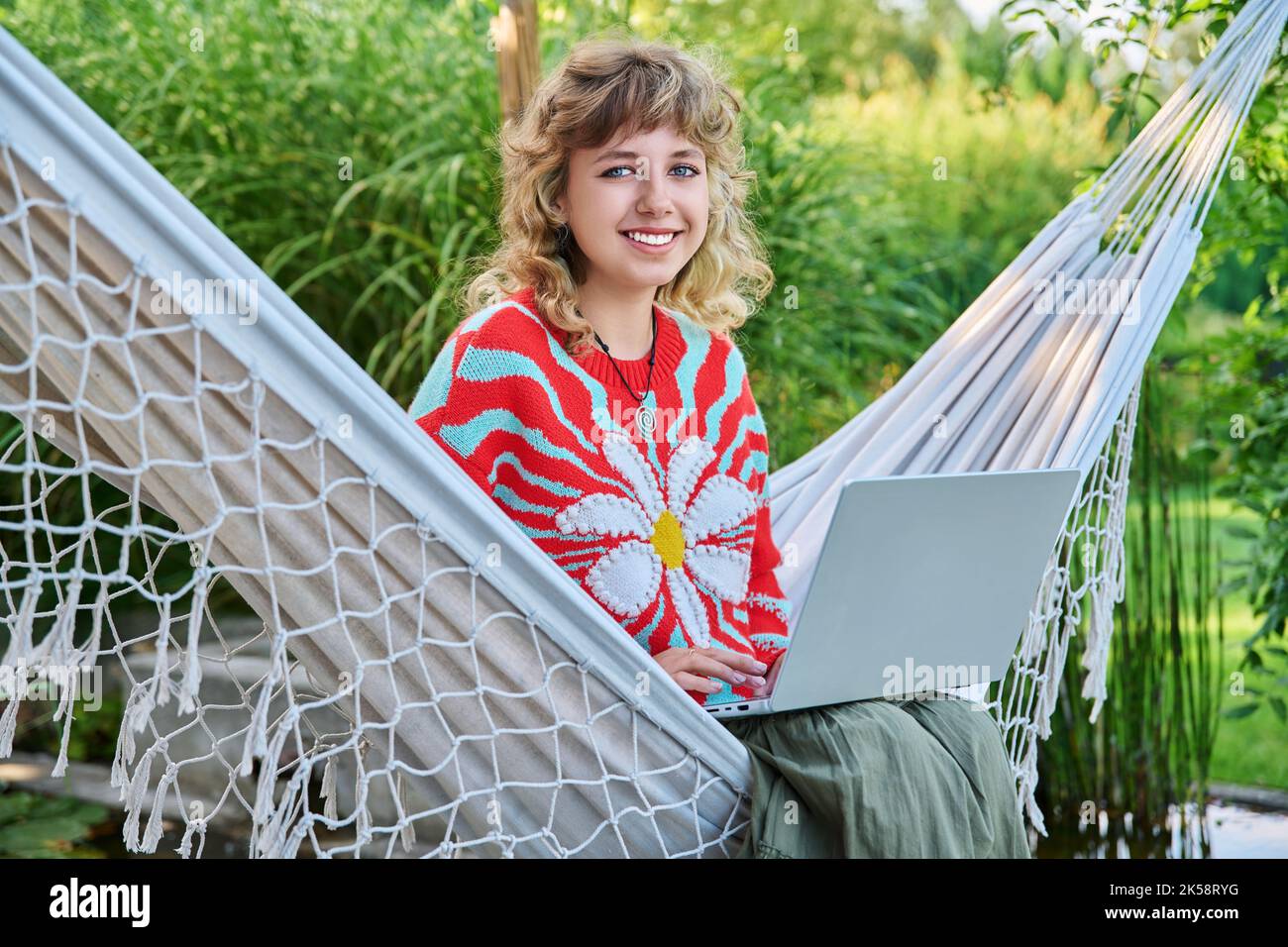 Portrait of teenage girl with laptop outdoor Stock Photo - Alamy
