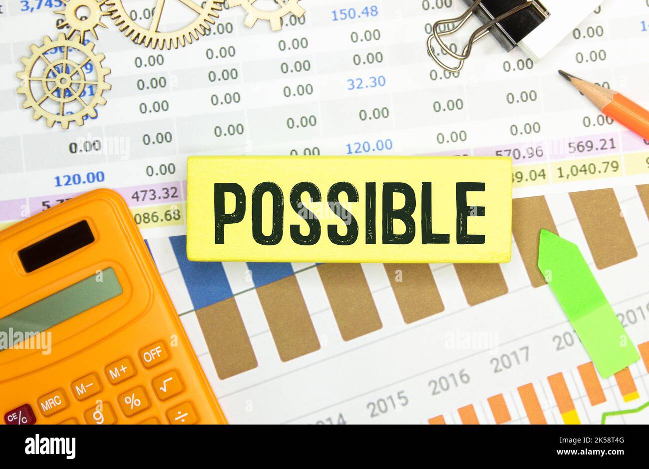 Wooden blocks on a blue background with the word possible and crossed ...