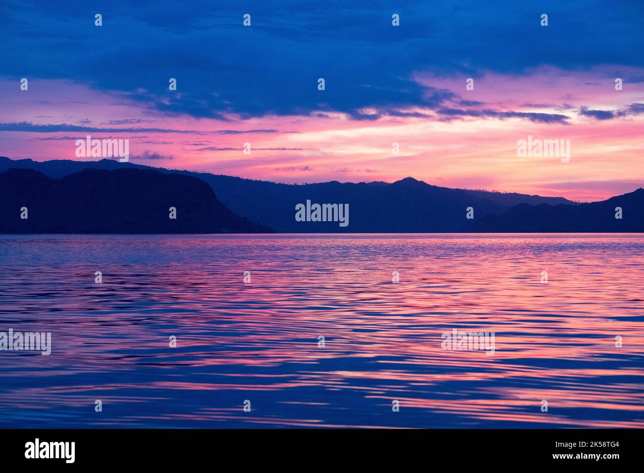 Indonesia, Komodo Island, Komodo National Park. Sunset view of islands ...