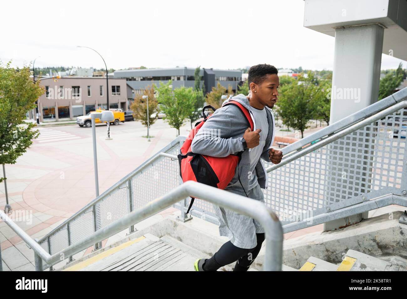 Person climbing up steps hi-res stock photography and images - Alamy