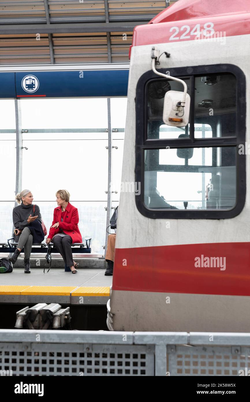 Caucasian women talking train hi-res stock photography and images - Alamy