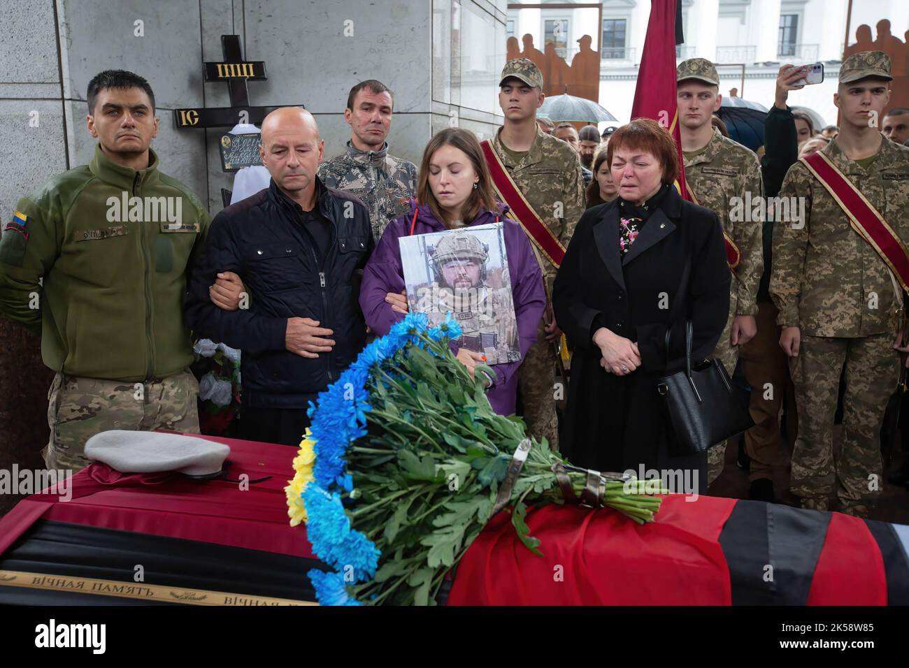 Relatives mourn at the coffin with the body of Roman Kosenko, nicknamed ...
