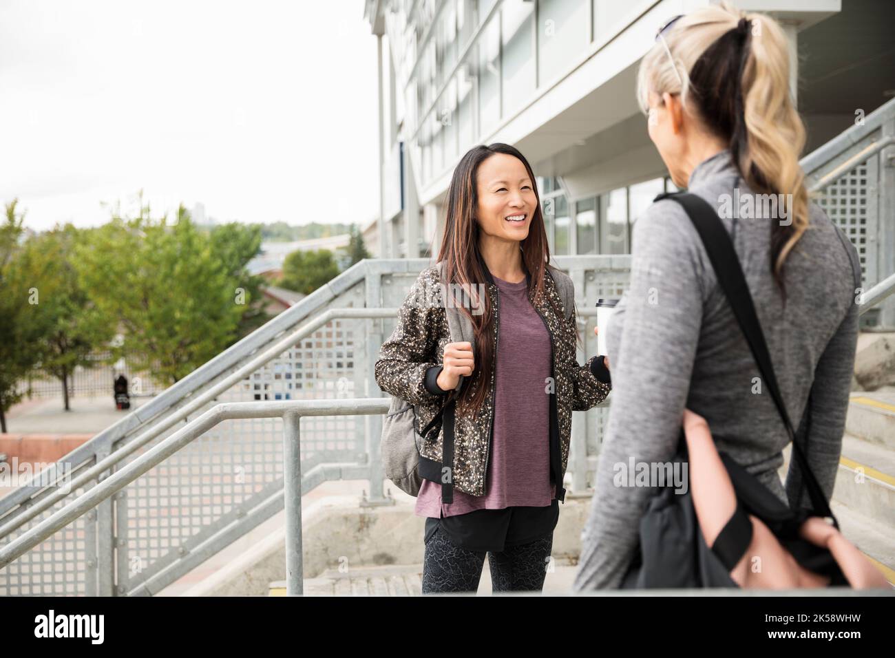 Women talking standing outdoors hi-res stock photography and images - Alamy