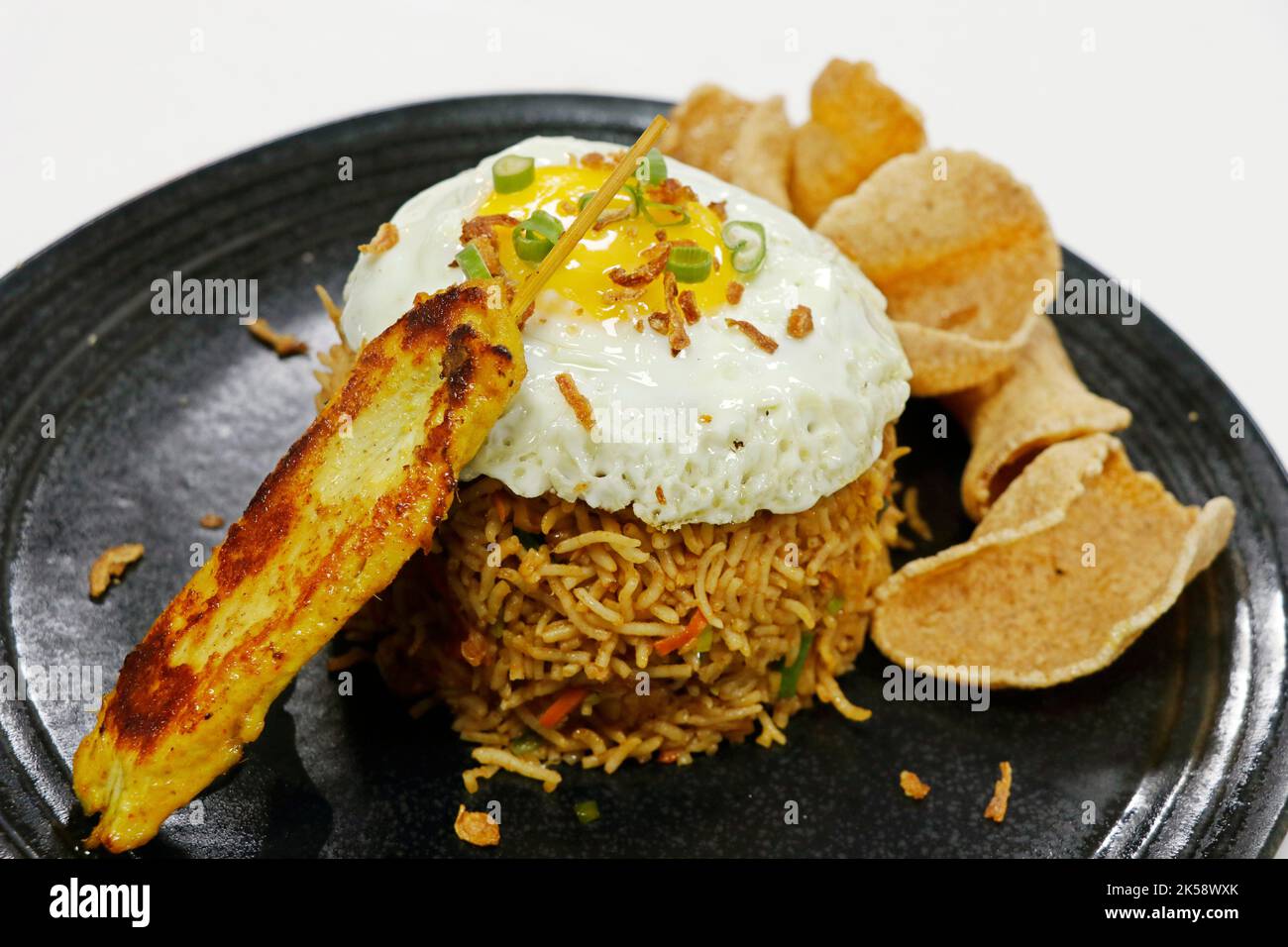 Asian food speciality Nasi goreng, literally meaning fried rice in ...
