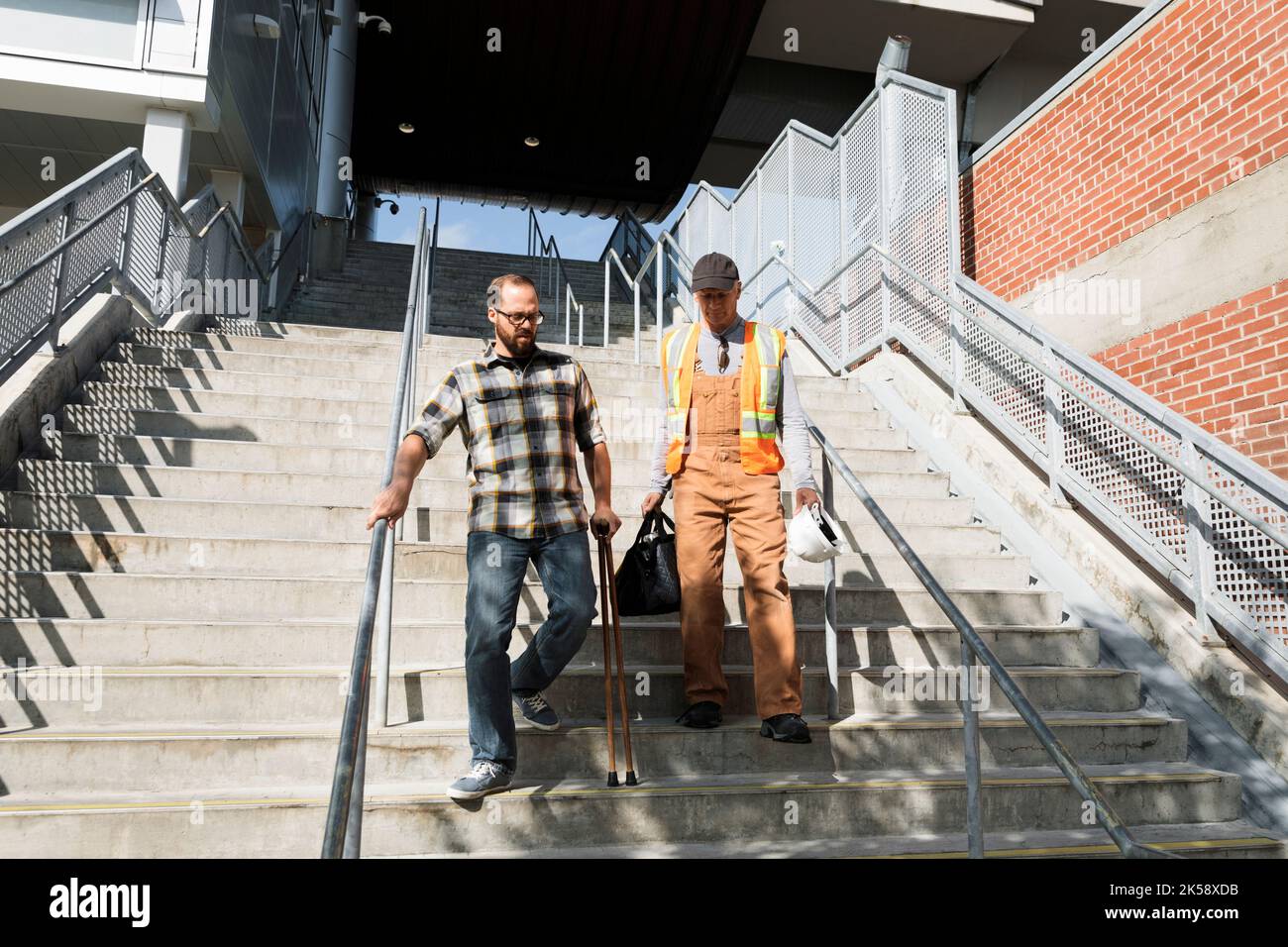 Two men carrying sticks hi-res stock photography and images - Alamy
