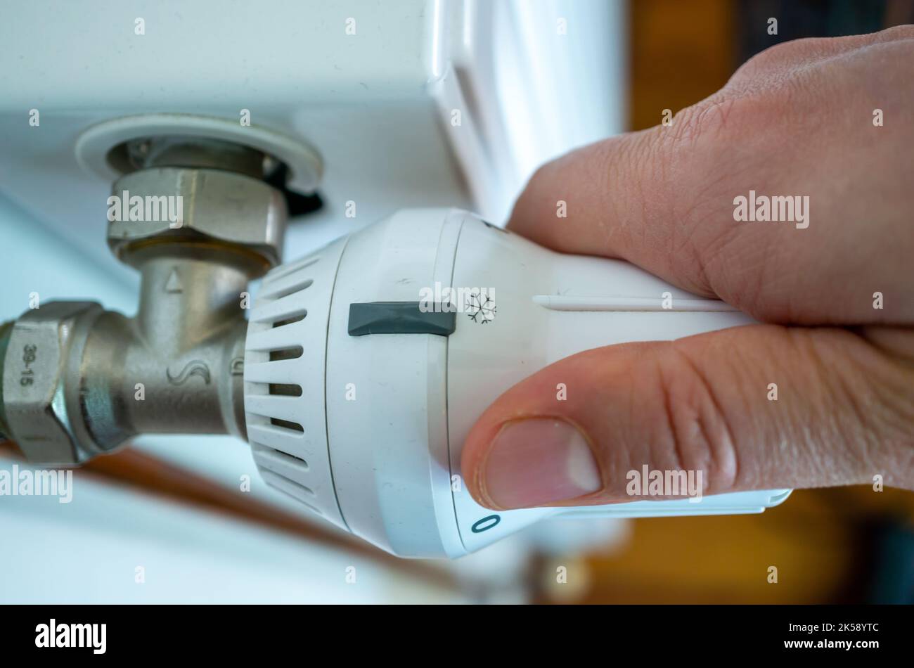 Man turns heating on cold hi-res stock photography and images - Alamy