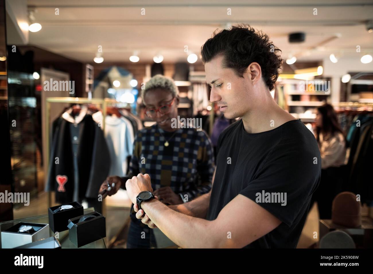 Man putting on watch hi-res stock photography and images - Alamy