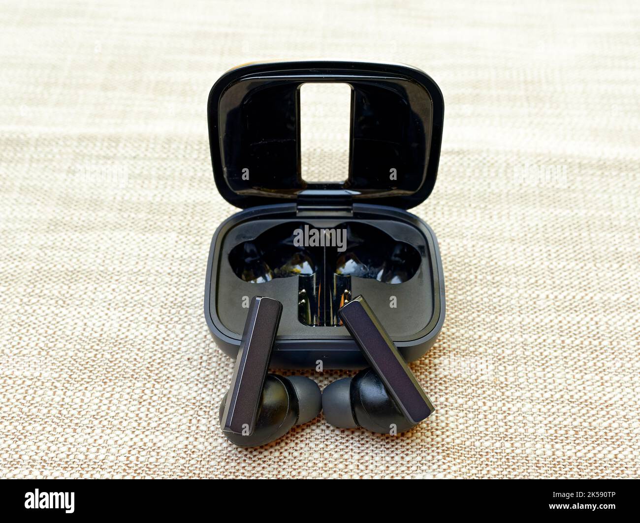 Black earbuds, used to listen to music, video or podcasts in private ...