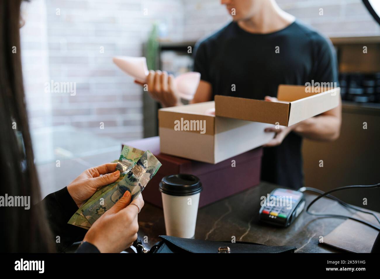 Shop customer buying shoes hi-res stock photography and images - Alamy