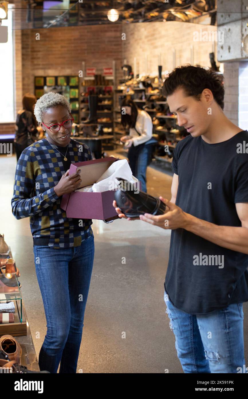African man selling shoe hi-res stock photography and images - Alamy