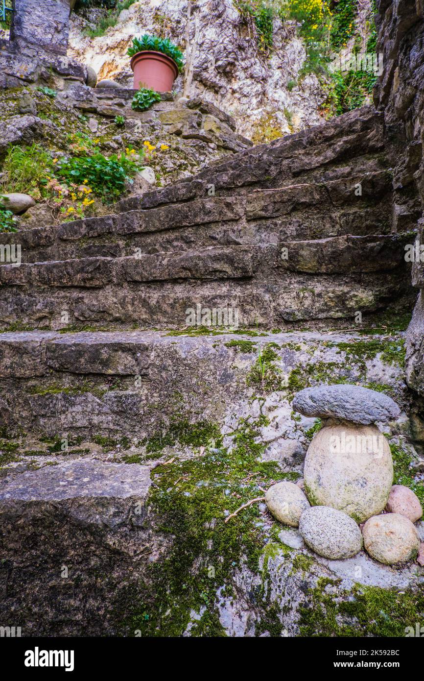Old cobblestone stairs in the medieval village of Rochecolombe in the ...