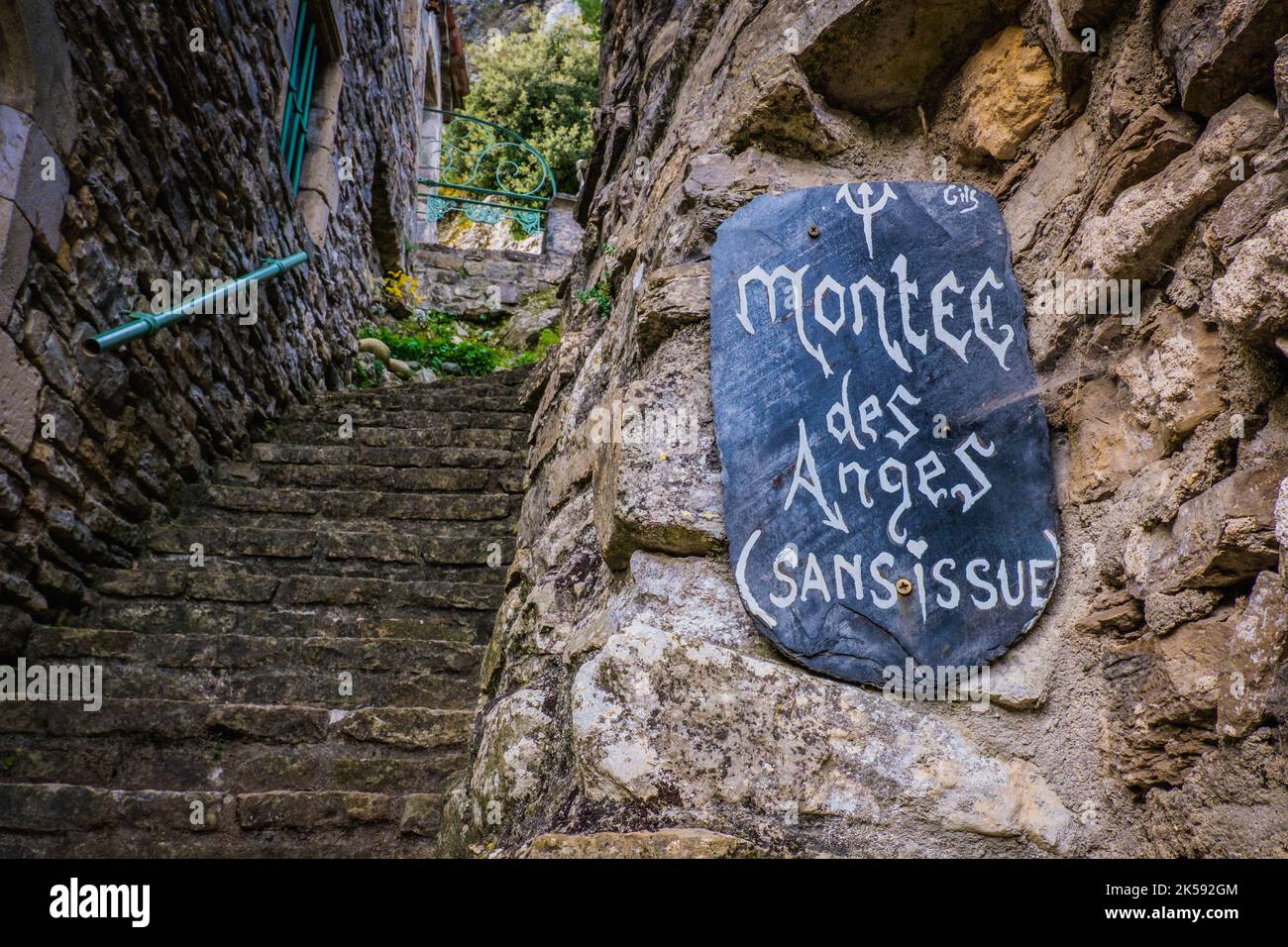 Old cobblestone stairs in the medieval village of Rochecolombe in the ...
