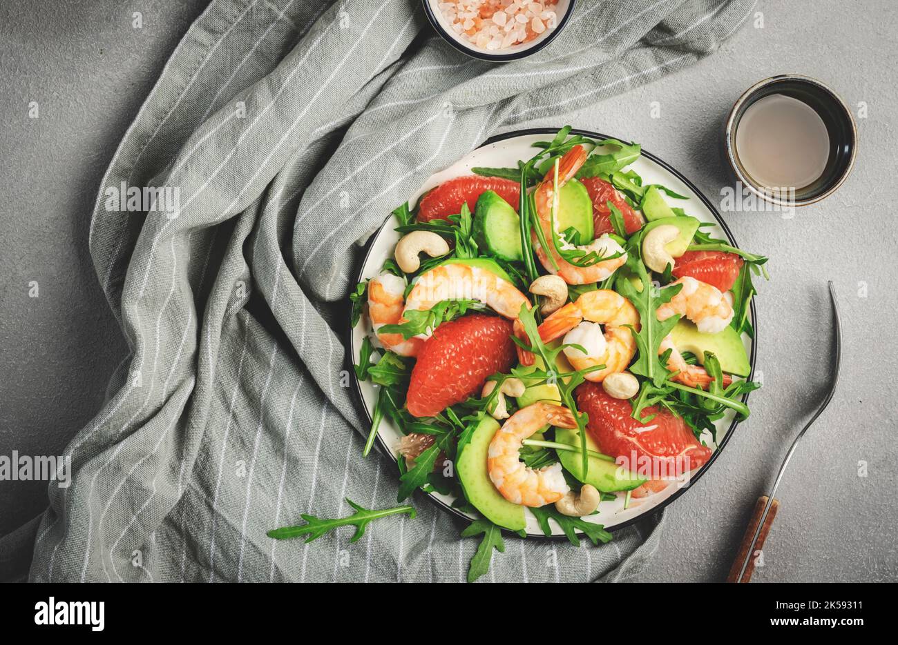 Healthy fresh salad with shrimps, avocado, grapefruit, arugula and ...