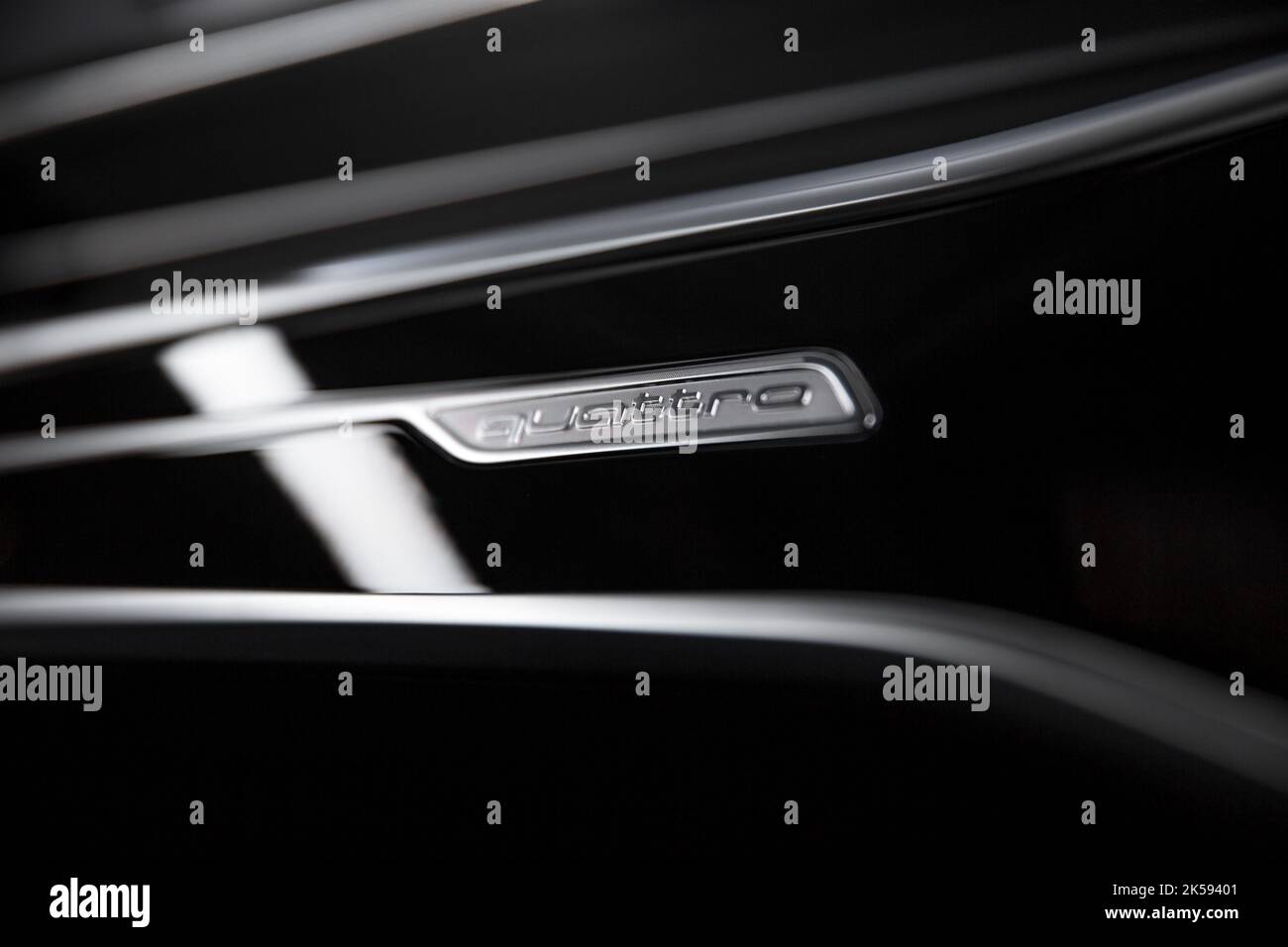 The Chrome Quattro Dashboard Badge On Piano Black Background With Red ...