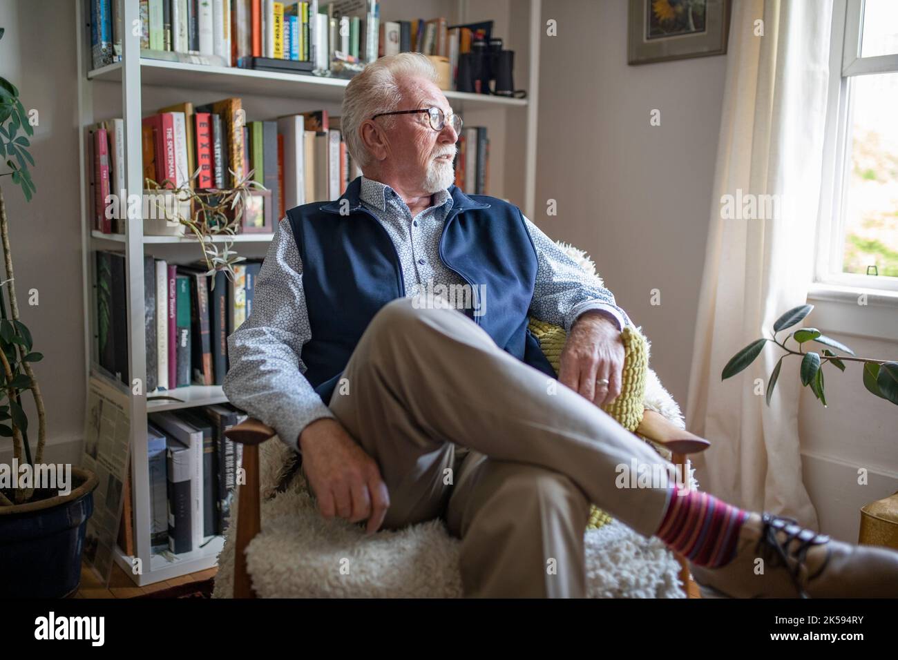 Man looking watching window hi-res stock photography and images - Alamy
