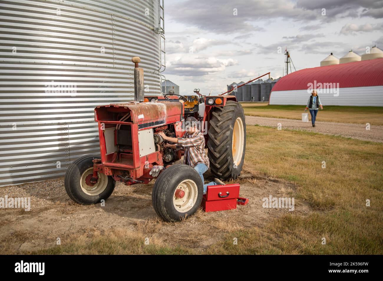 Boy fixing tractor hi-res stock photography and images - Alamy