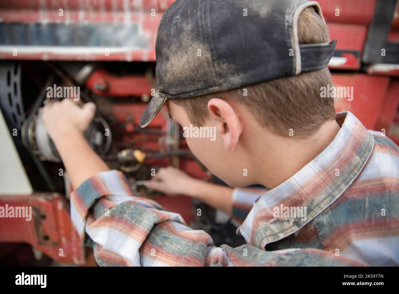 Boy fixing tractor hi-res stock photography and images - Alamy Boy fixing tractor hi-res stock photography and images - Alamy