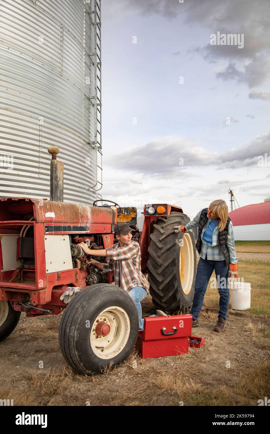 Boy fixing tractor hi-res stock photography and images - Alamy